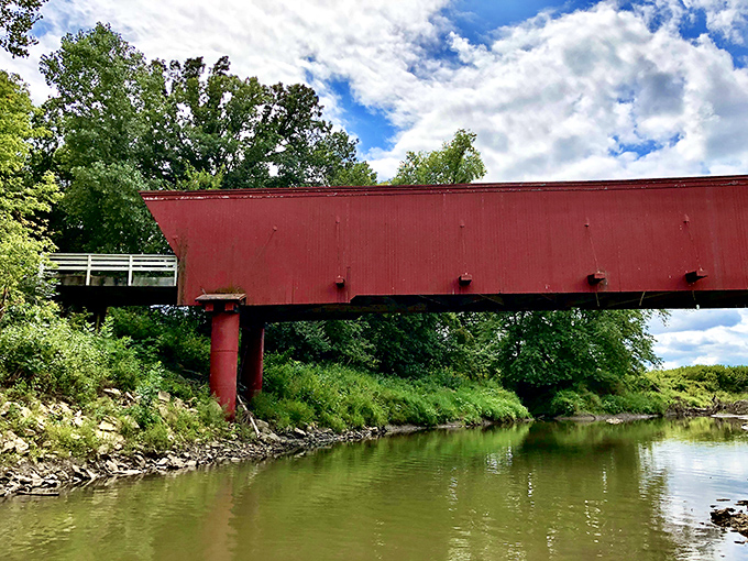 From the riverbank, the bridge's reflection creates a perfect symmetry&mdash;nature and human ingenuity in a harmonious duet across Middle River.