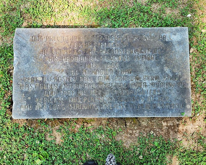 History etched in stone&mdash;this weathered marker tells tales of utopian dreamers who found harmony in geometric perfection.