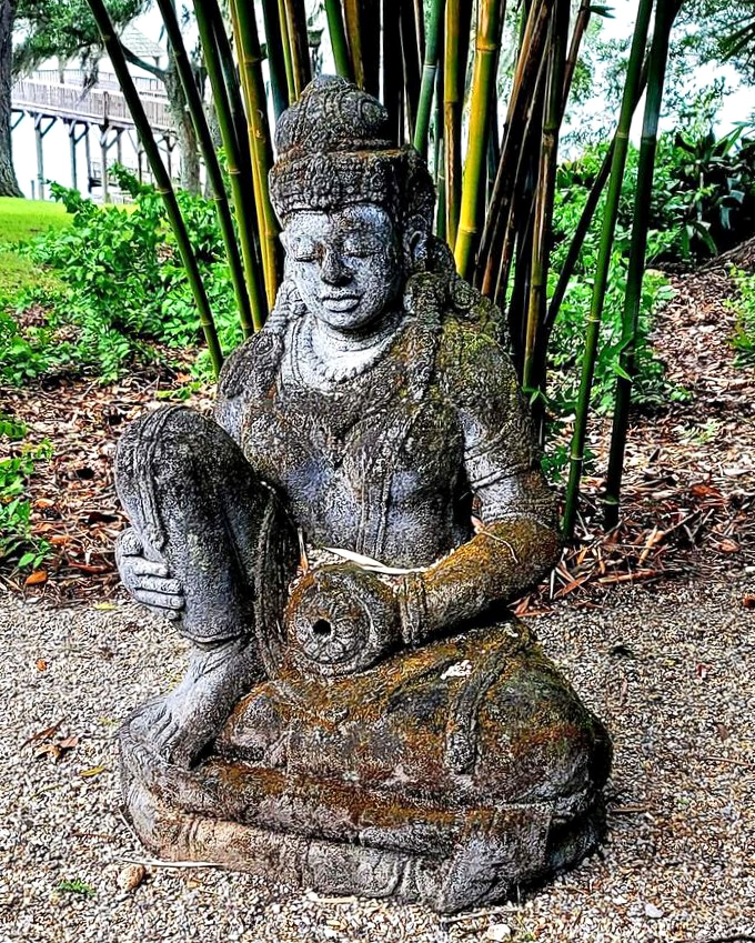 Ancient wisdom meets Louisiana greenery. This serene statue nestled among bamboo stalks looks like it's been meditating here since before crawfish were invented.