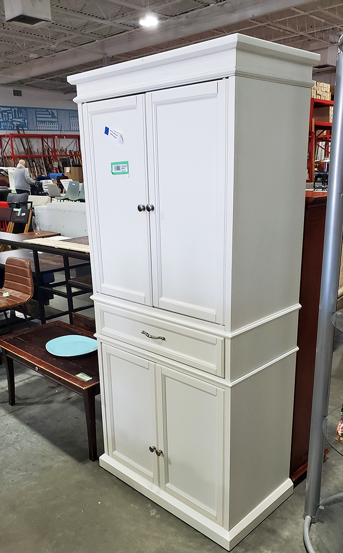 That pristine white cabinet could anchor your kitchen for a fraction of retail cost, proving style doesn't require liquidating retirement accounts.