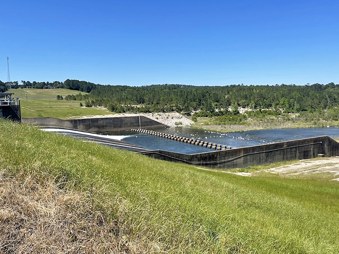 The spillway &ndash; engineering marvel meets natural wonder. Like watching the world's most relaxing infinity pool designed by practical dreamers.
