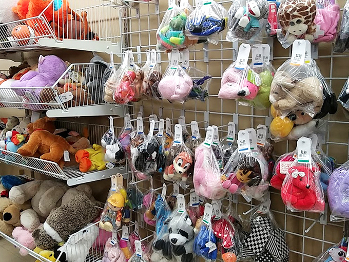 A plush menagerie hangs in hopeful suspension, each stuffed animal silently promising to become some child's next beloved bedtime companion.