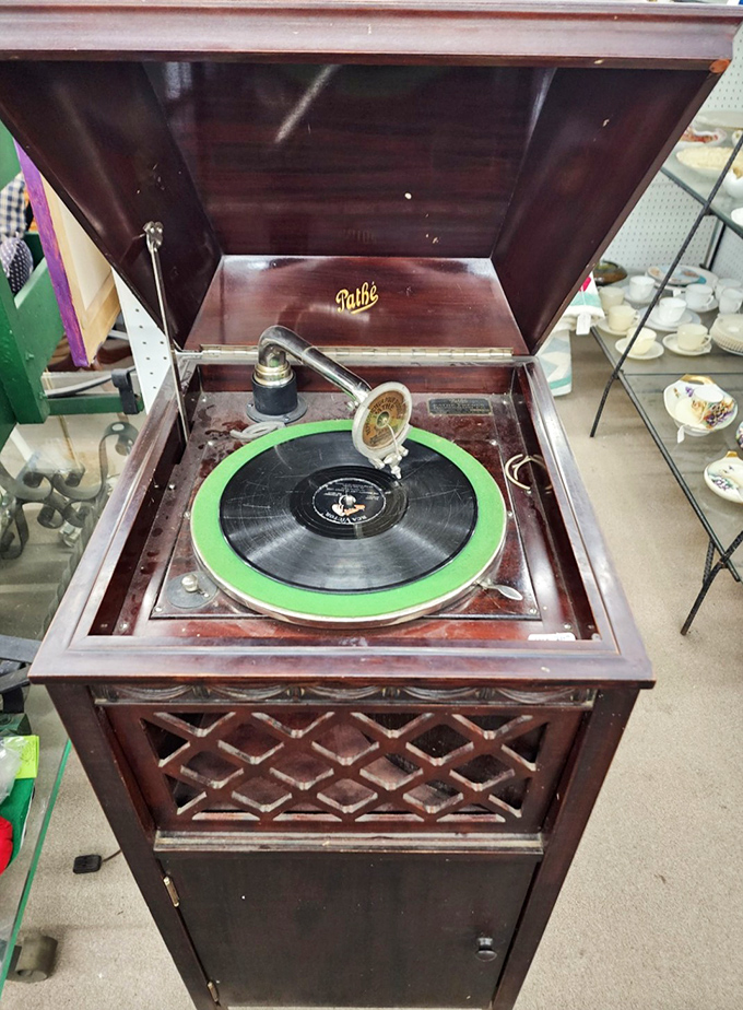 A Path&eacute; record player waits patiently for its next dance. That green turntable has seen more musical history than most concert venues.
