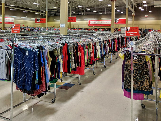 Endless rows of color-coded clothing create a textile rainbow. Somewhere in this sea of fabric lurks the perfect vintage find.