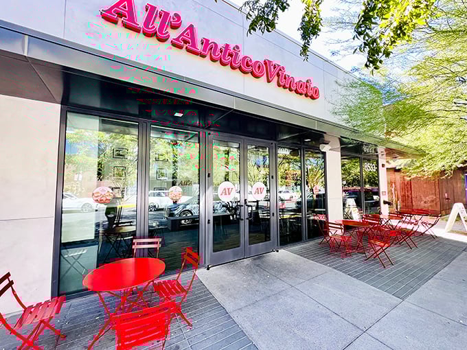 All'Antico Vinaio's vibrant red seating invites you to linger over Italian sandwiches that transport you straight to Florence.