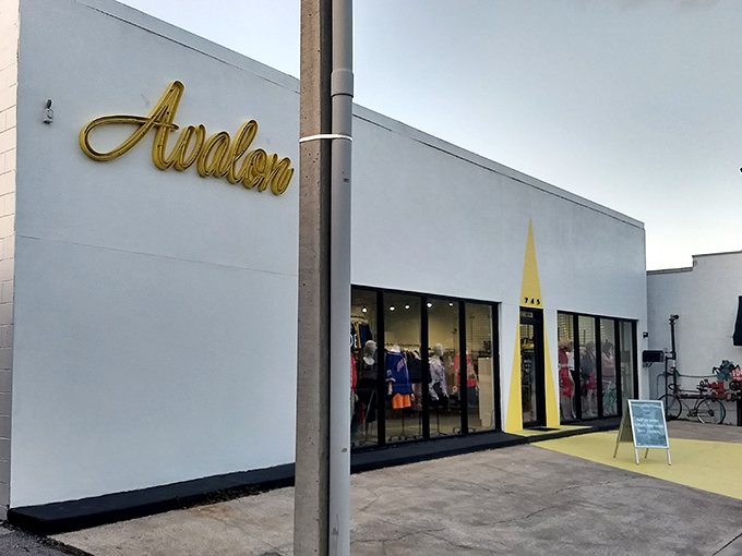 Avalon's sleek white exterior with elegant gold lettering hints this isn't your grandmother's thrift store experience.