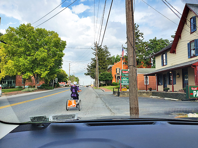 Main Street feels like stepping into a Norman Rockwell painting where buggies share the road peacefully.