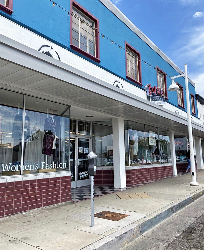 Buffalo Exchange's vibrant blue façade stands out like a fashionista's dream in Albuquerque's urban landscape.