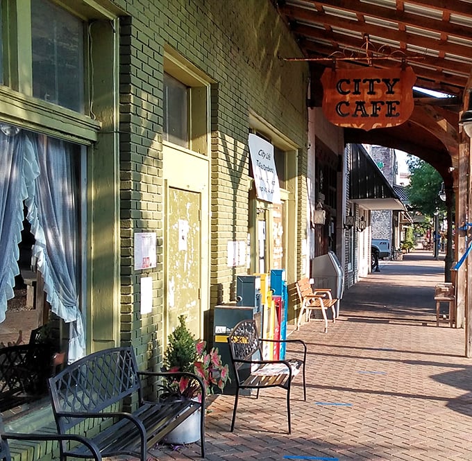City Cafe's unassuming storefront hides beneath a wooden awning in historic Northport, promising home-cooked treasures inside.