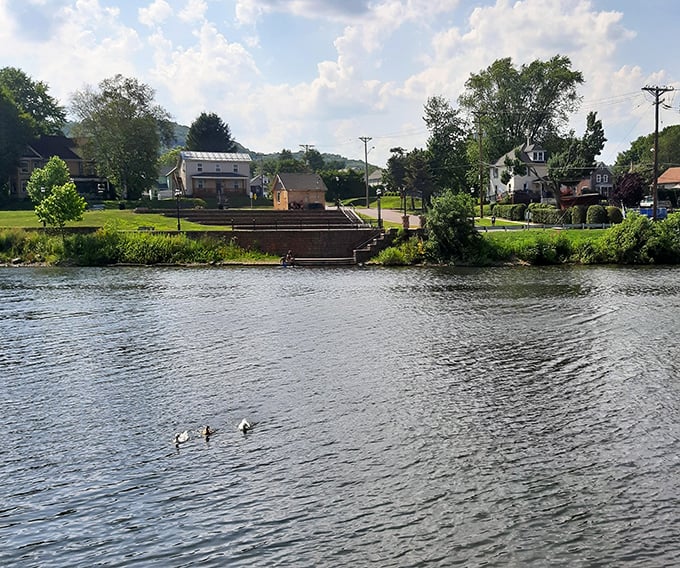 Small-town riverfront living at its finest, where ducks paddle peacefully and neighbors still wave from their porches.