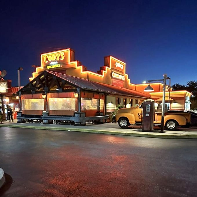 Cody's neon sign glows like a beacon in the night, guiding hungry travelers to steak salvation since before Instagram food pics were a thing.