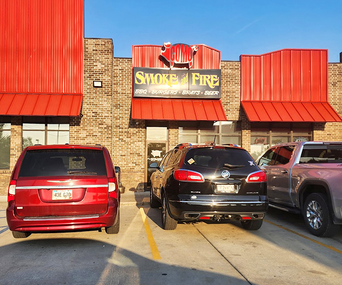 Como Smoke and Fire's bold red roof stands out like a beacon for barbecue pilgrims seeking smoky salvation.