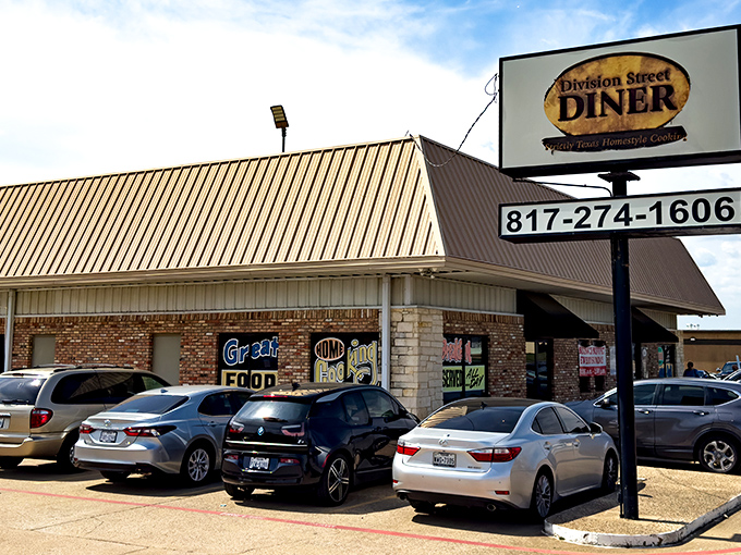 Morning light catches the brick facade of Division Street Diner, where inside, breakfast platters have been satisfying Texans for generations.