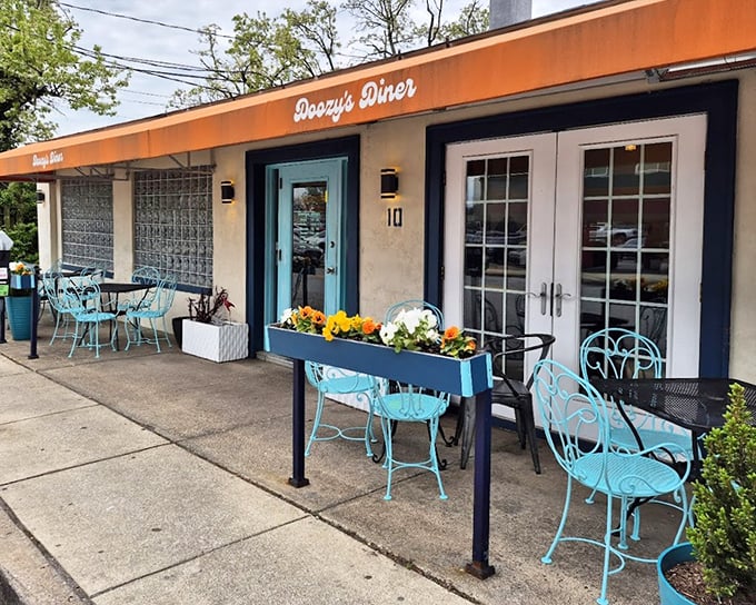 Doozy's turquoise chairs and flower boxes create the perfect sidewalk oasis &ndash; like your favorite aunt opened a diner with Martha Stewart.