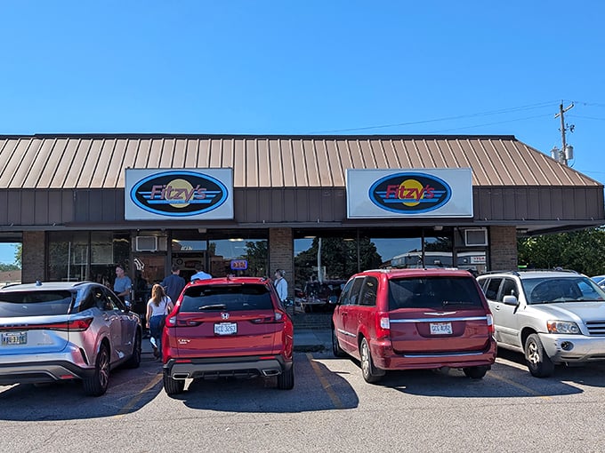 Fitzy's windows advertise life's essentials: hotdogs, breakfast, milkshakes, and homemade pies. What more could anyone need?