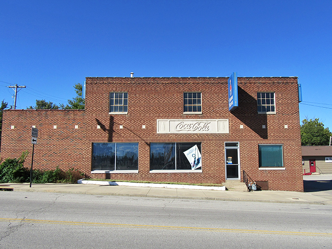 This vintage brick building in Fort Scott, complete with a classic Coca-Cola sign, offers a nostalgic glimpse into small-town Americana.