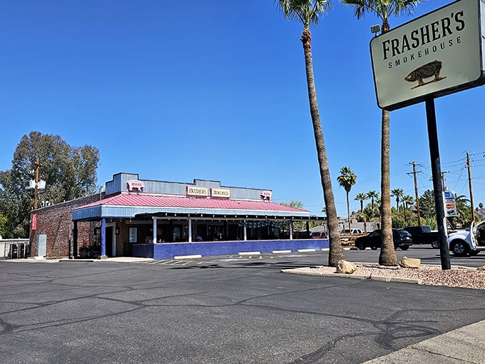 Frasher's blue and red building stands out like a beacon for BBQ lovers seeking smoky salvation.