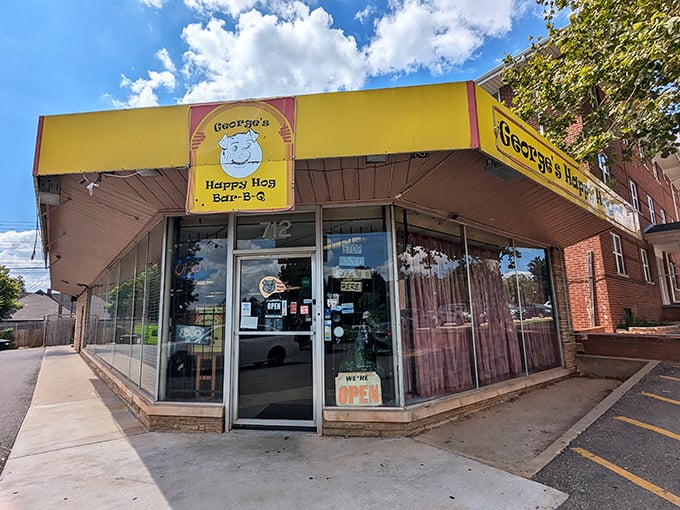 George's Happy Hog's sunny yellow storefront brightens the neighborhood almost as much as their legendary ribs brighten your day.