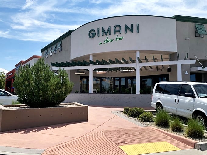 Gimani's curved facade and desert landscaping create a modern oasis for pizza lovers. Sleek outside, soulful slices inside!