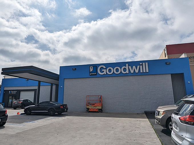 Goodwill's bright blue exterior stands out like a thrifting oasis in the urban landscape. Even the building looks cheerful about its mission.