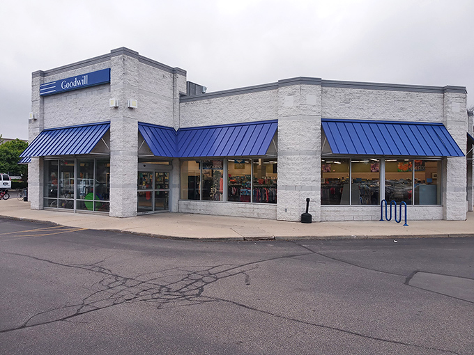 Goodwill's crisp white building with those signature blue awnings &ndash; like a department store where everything has a story.
