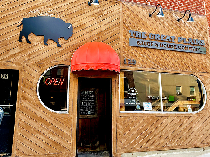 The Great Plains' wooden exterior with its buffalo silhouette promises something uniquely Iowan. Pizza with prairie personality awaits inside.