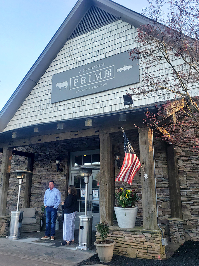 Stone and timber architecture suggests serious steakhouse business happening behind these handsome mountain lodge walls. 