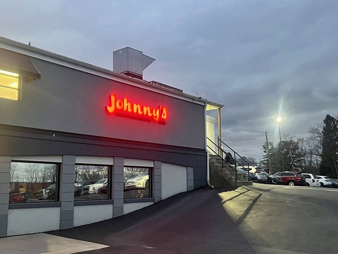 Johnny's red neon sign glows like a beacon for steak lovers. It's not trying to be fancy&mdash;it's too busy being delicious.