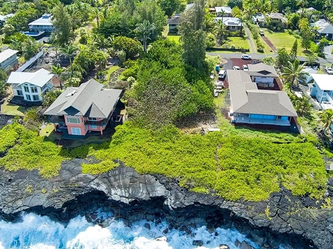 Keaau's lush greenery stretches toward the horizon, creating a patchwork quilt of tropical abundance that feeds both body and soul.