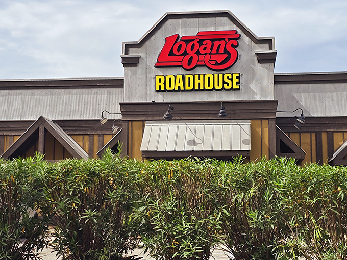 Logan's iconic roadhouse sign stands tall, beckoning hungry travelers with promises of mesquite-grilled goodness.