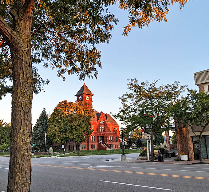 Ludington's magnificent red courthouse basks in golden hour light &ndash; that clock tower has kept small-town time for generations.