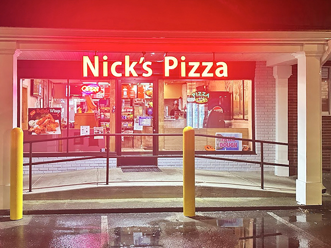 Nick's Pizza: That glowing red sign is like a lighthouse for the pizza-starved, guiding hungry souls to safe harbor on a rainy night.
