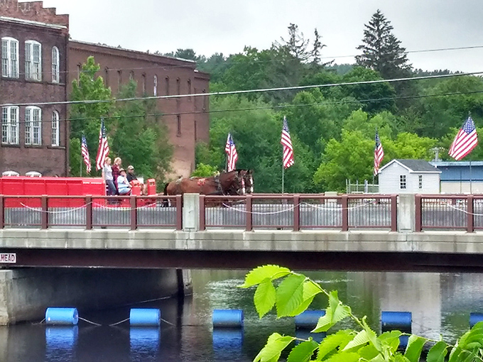 Orange's buildings line up like old friends on a street where American flags flutter and a horse-drawn carriage still feels right at home.