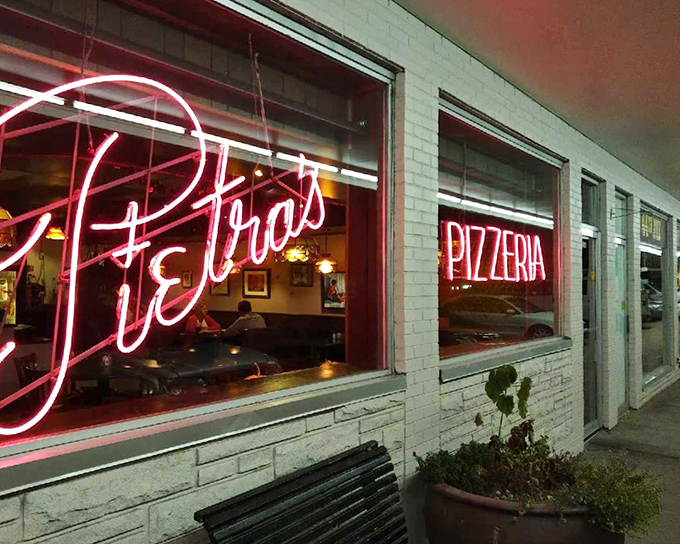 Pietra's glowing neon window sign is like a lighthouse for the pizza-starved, promising safe harbor for your appetite.