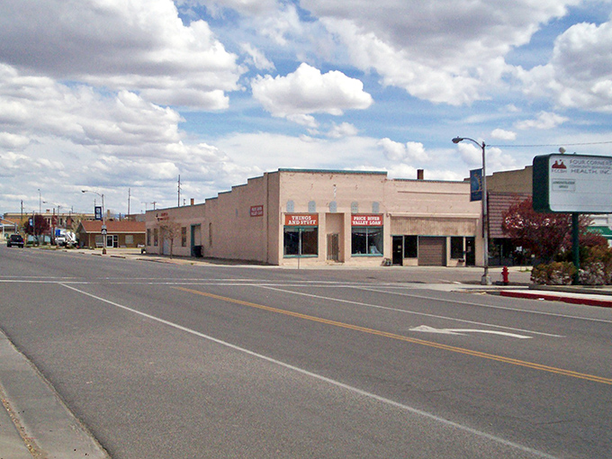 Price delivers dramatic mountain backdrops with affordable small-town living. That historic hotel sign hints at stories from Utah's colorful past.