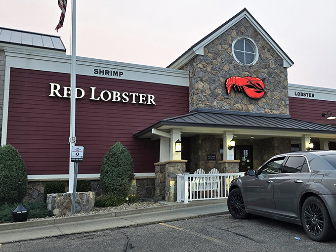"The stone facade says 'rustic charm,' but that red lobster sign speaks a universal language: 'butter-dipped deliciousness inside!'"