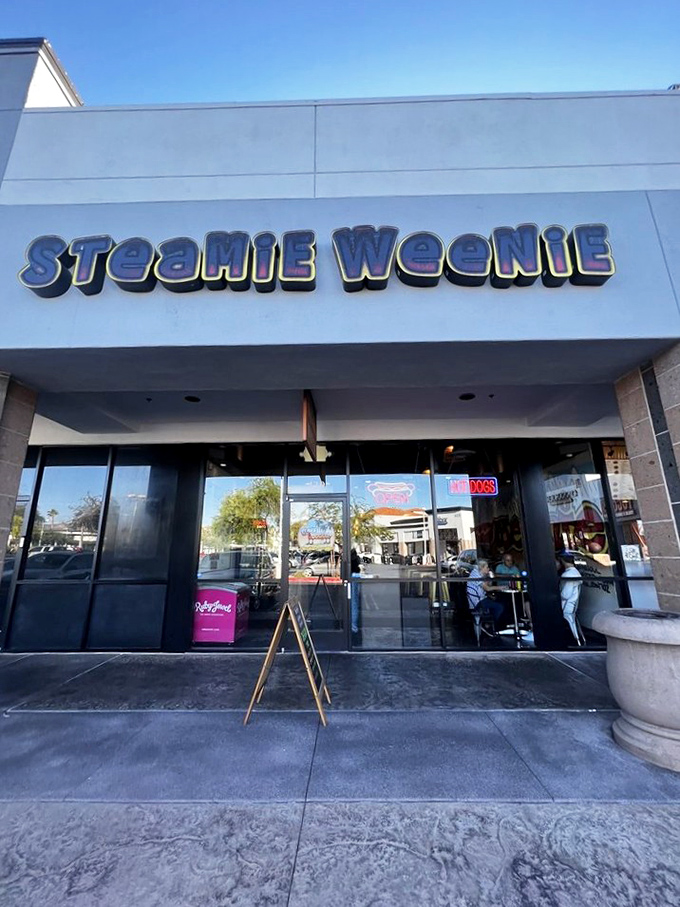 Steamie Weenie's playful name and bright blue signage promise hot dog happiness in suburban Henderson. Simple joy on a bun!