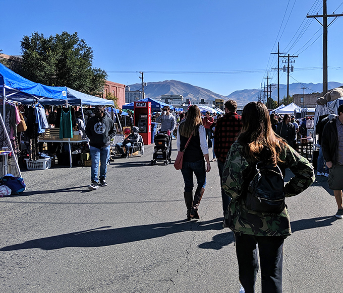 Mountain views frame this bustling marketplace where modern city life meets timeless treasure hunting traditions.