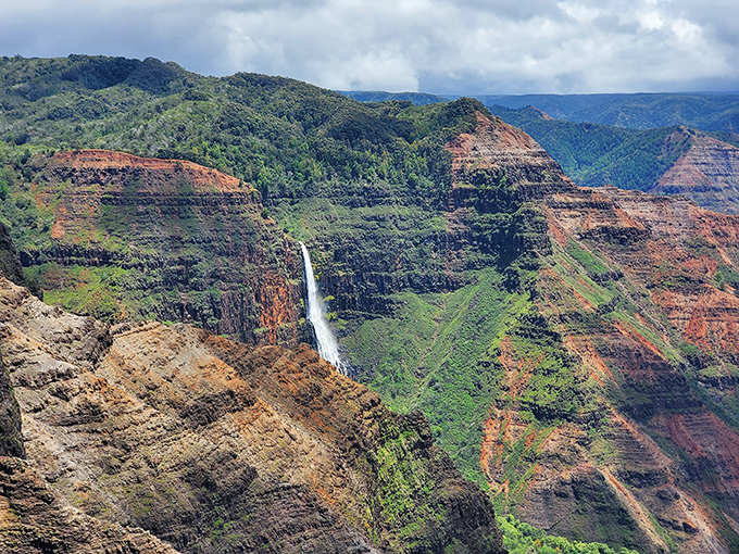 Waimea Canyon's layers of red and green tell Hawaii's geological story. The Grand Canyon might be calling to ask for decorating tips.