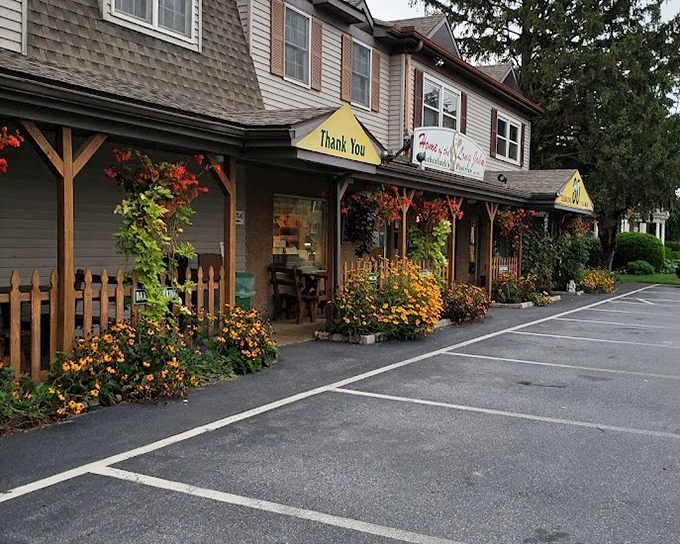 The flower-lined entrance isn't just pretty&mdash;it's nature's way of saying "Something delicious this way comes!"