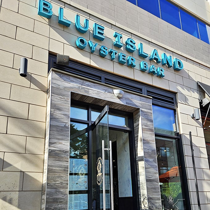 The sleek blue signage promises a coastal escape, while the modern entrance suggests seafood with style rather than pretension.