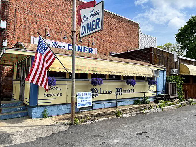 Blue Moon Diner's patriotic display and classic cream-and-blue exterior make it Gardner's go-to spot for honest breakfast served with a side of community.