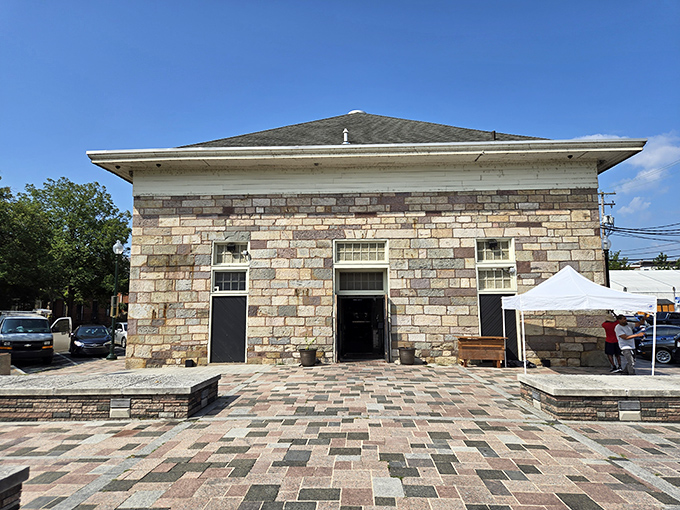 Sunlight streams through Broad Street Market's classic architecture, illuminating a gathering place where history and commerce dance together.