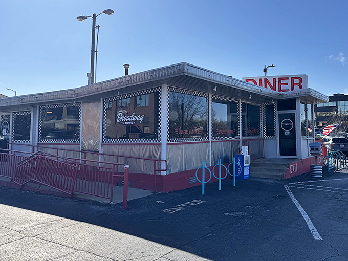 Classic diner architecture with that unmistakable checkered trim. The "DINER" sign is like a beacon for the breakfast-hungry.