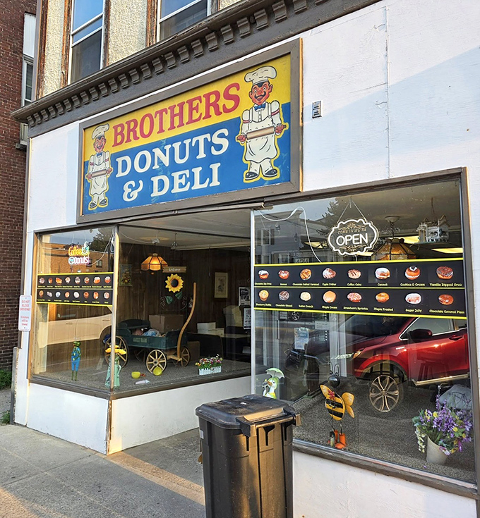 Those cartoon bakers in the window seem as excited about donuts as you're about to be. 
