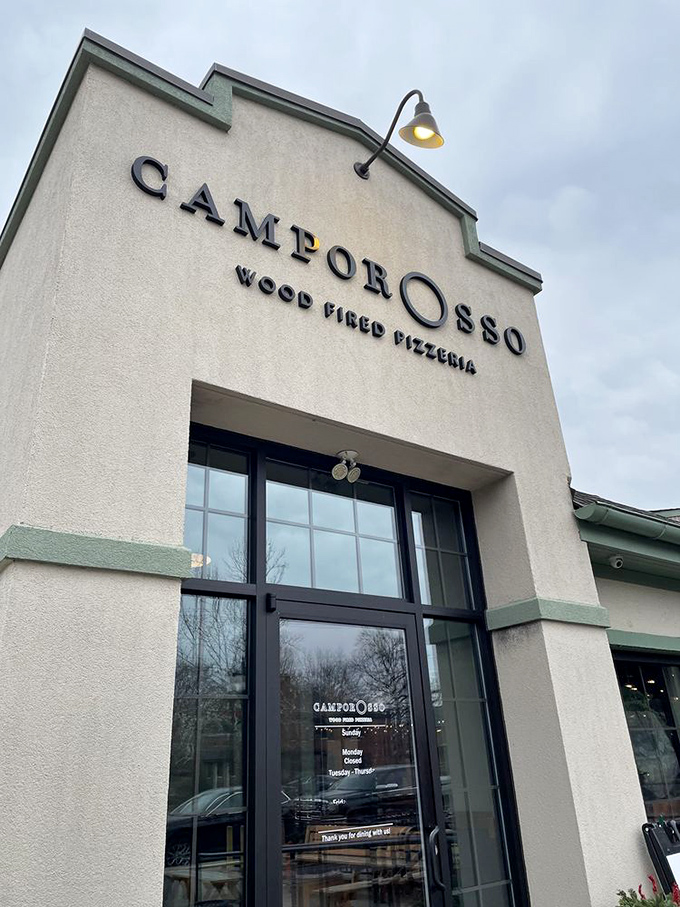 Don't let the understated exterior fool you - serious pizza artistry awaits within.