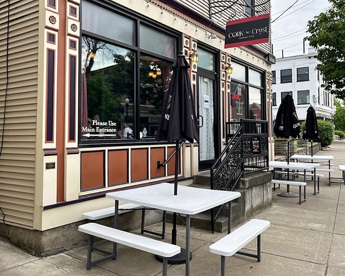 Outdoor picnic tables invite you to enjoy gourmet pizza al fresco &ndash; simple pleasures with sophisticated flavors.