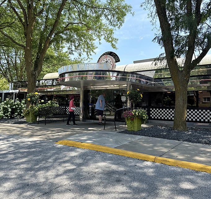 Classic diner architecture meets tree-lined streets where pancakes and memories are made every single morning.