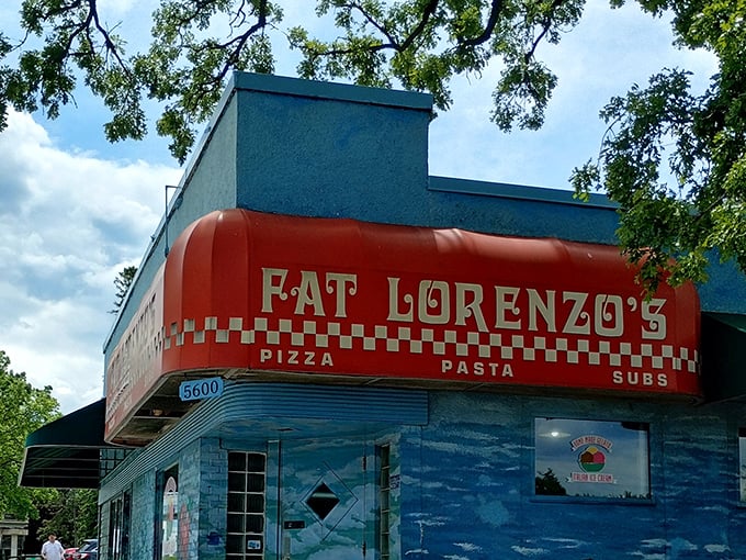 Blue and red building standing tall, promising portions as generous as its colorful personality.