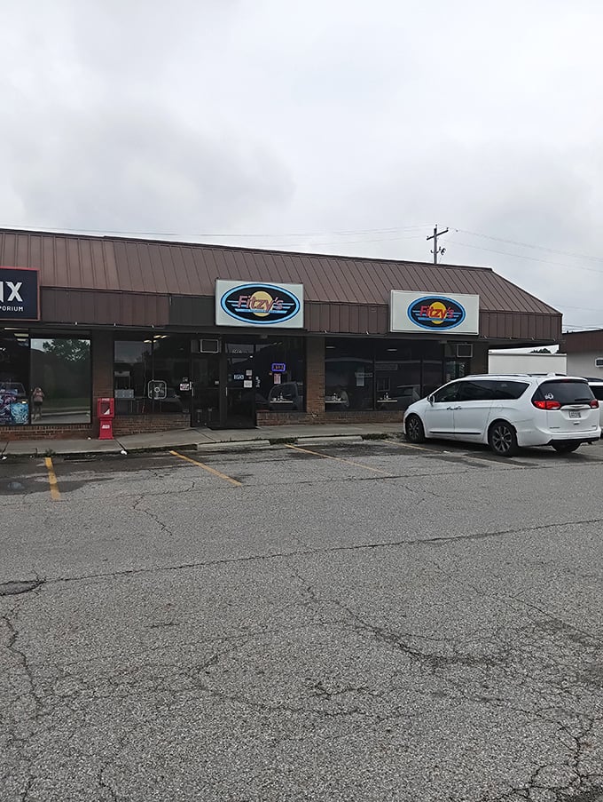 The classic white siding and striped awnings of Fitzy's look like they were plucked straight from a 1950s postcard.